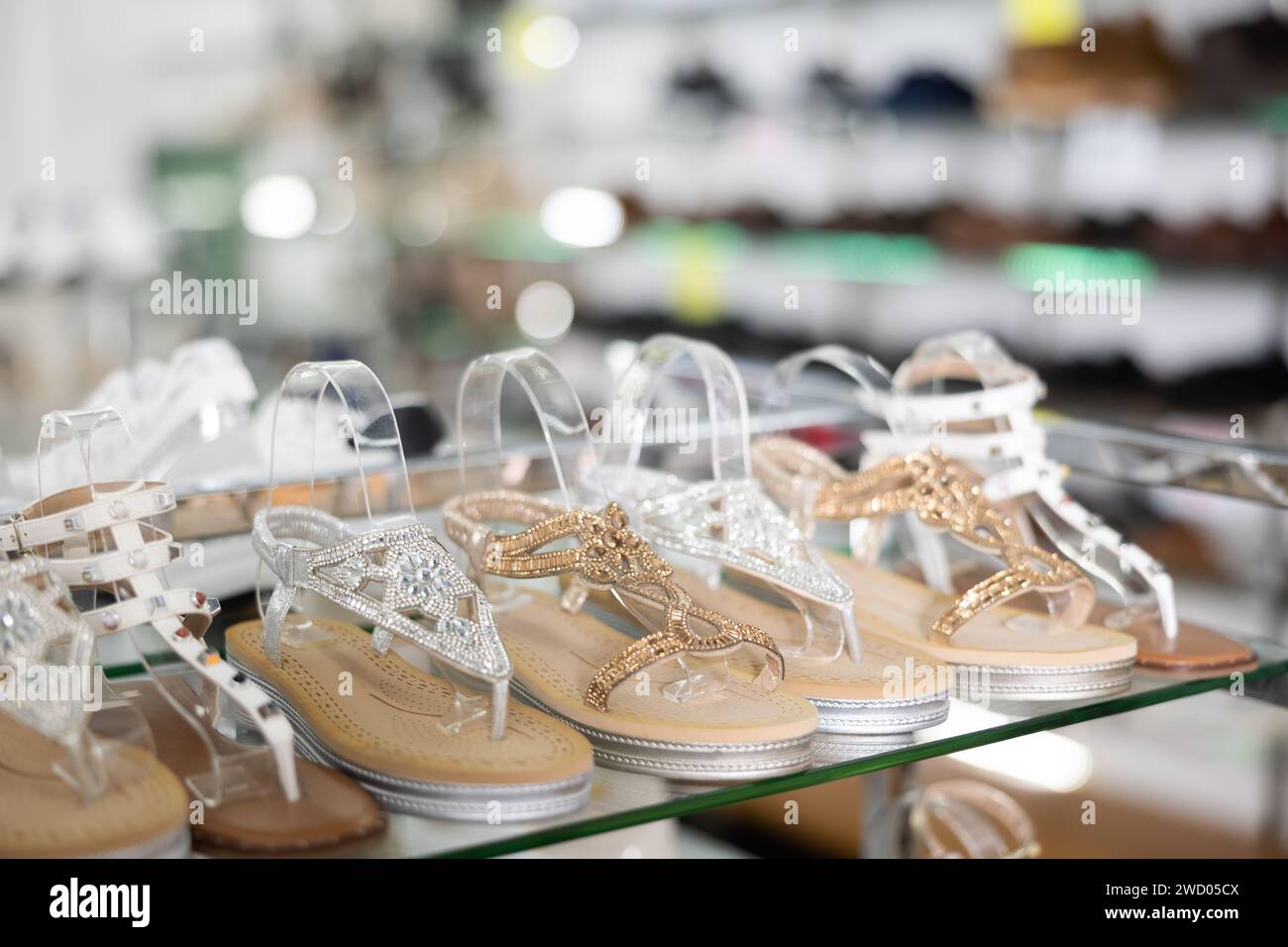 Womens sandals of latest summer collection are presented on glass ...