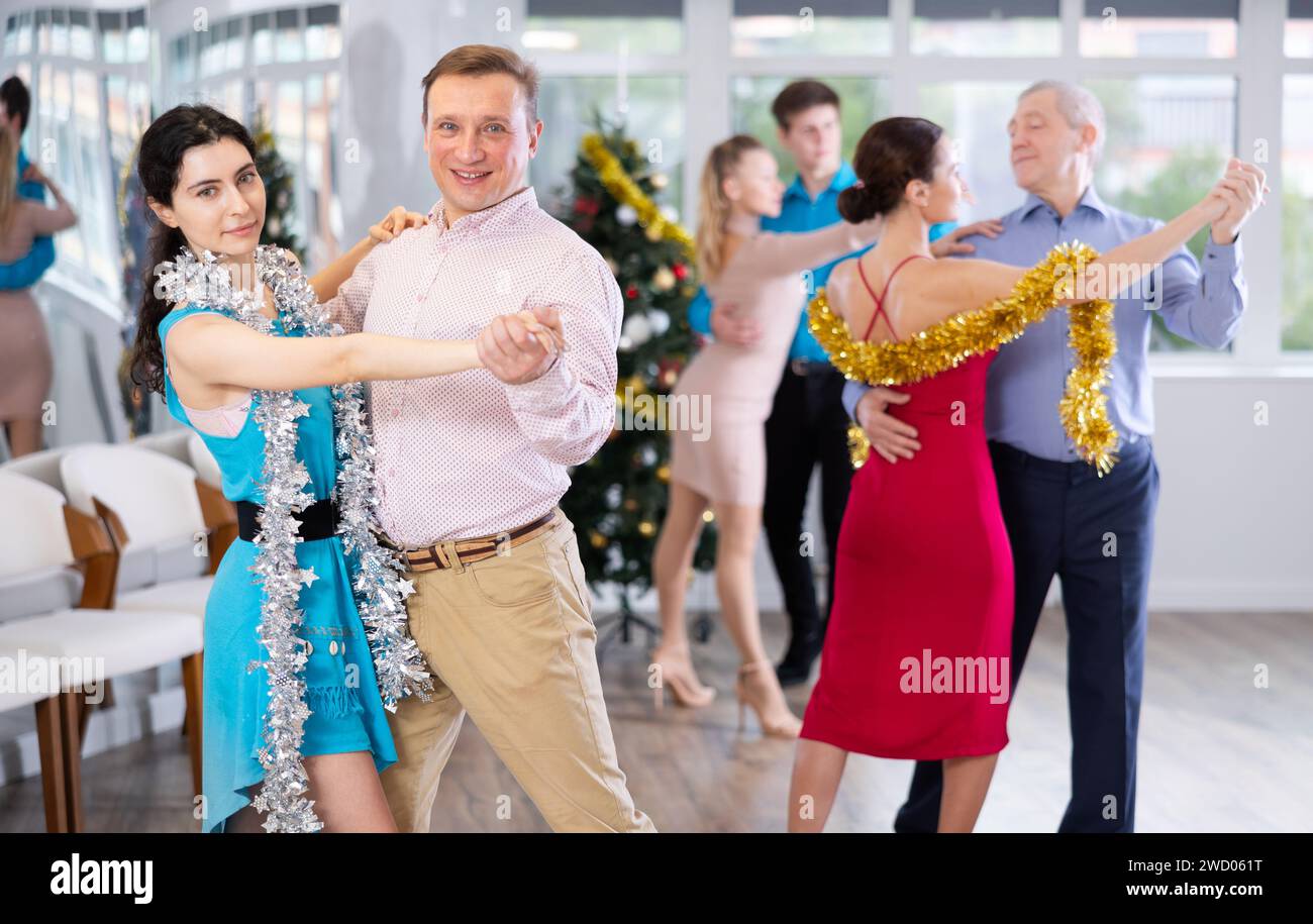 Couples dancing during Christmas - men and women dancing tango or samba ...