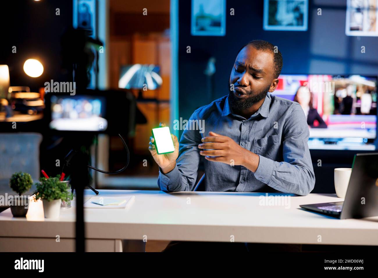 Content creator filming tech tutorial on how to do mini RGB lights ...