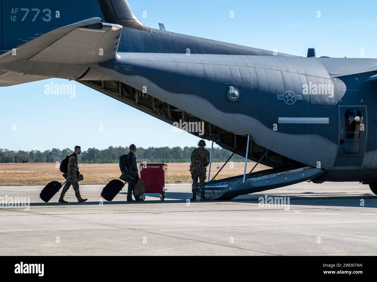 U.S. Air Force Airmen from the 71st Rescue and Rescue Generation Squadrons load cargo onto an HC ...