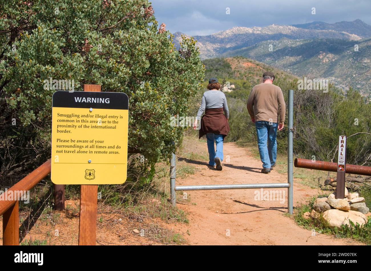 Border crossing warning sign with wilderness boundary sign, Pine Creek ...