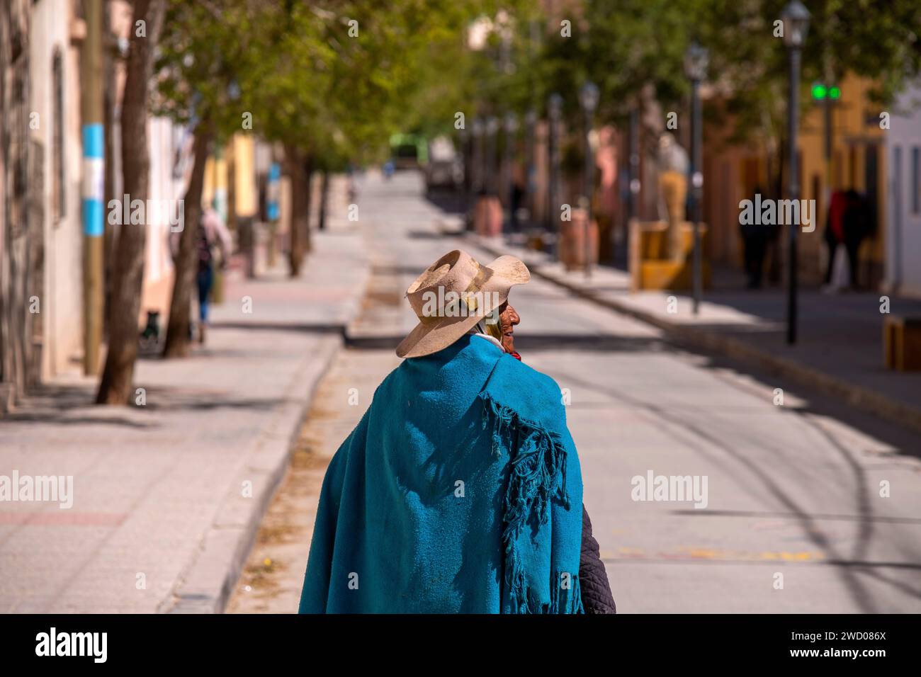Old woman wearing a traditional andes blue poncho on the steet at San ...