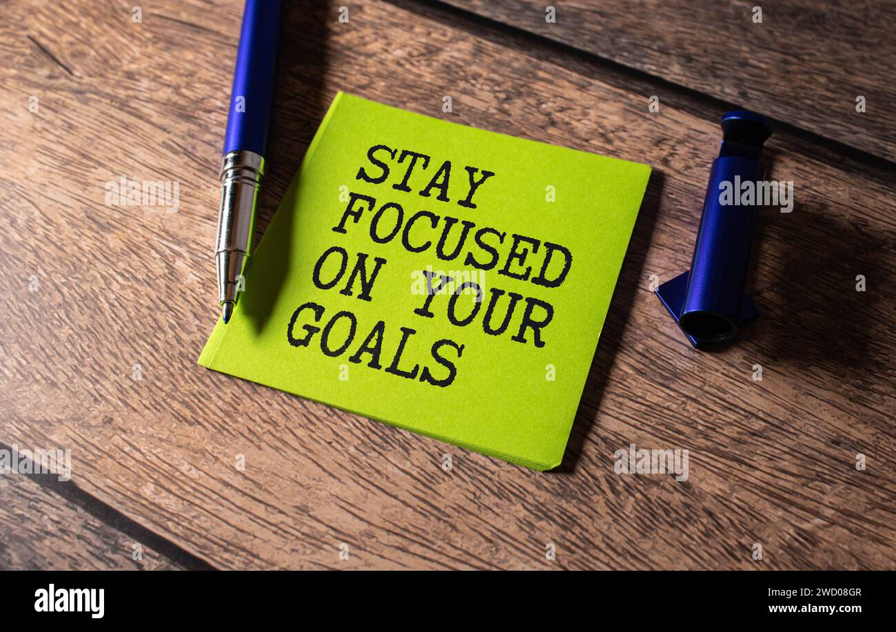Inspirational quote - Stay focused on your goals. With text message on ...