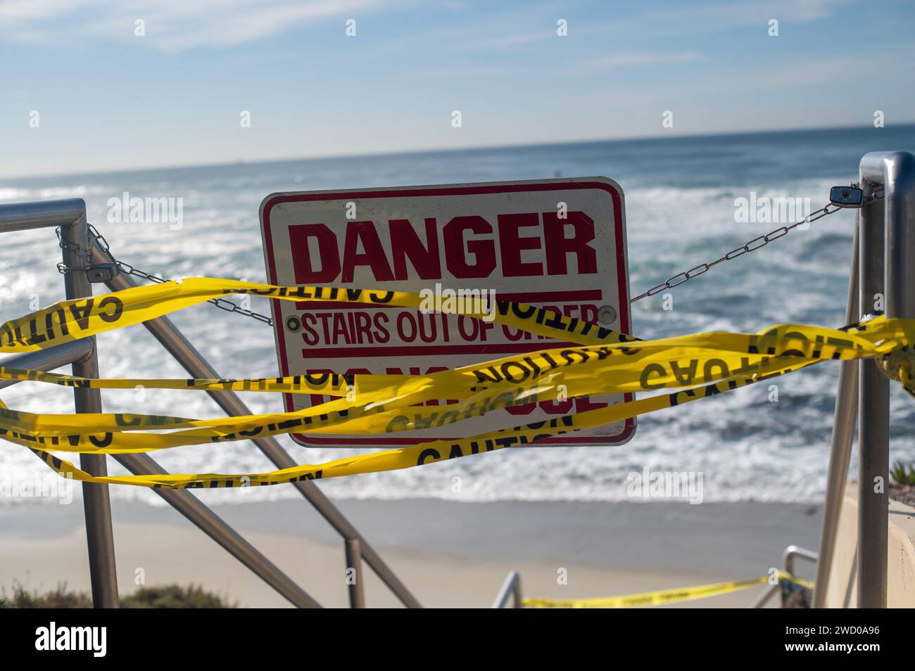 Danger sign at the oceanside Stock Photo - Alamy