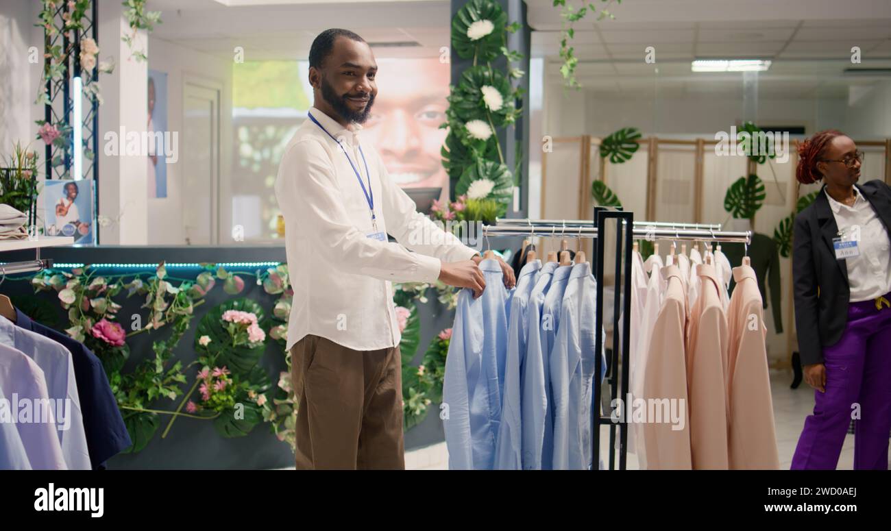 Worker arranging stylish clothes hi-res stock photography and images ...
