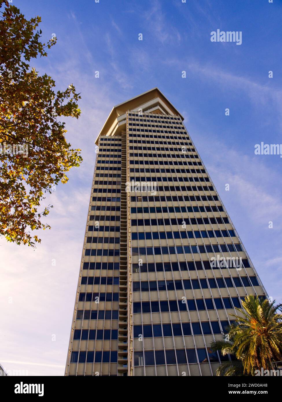Barcelona, Spain - November 20, 2022: Edificio Colon low angle view. An office skyscraper with ...