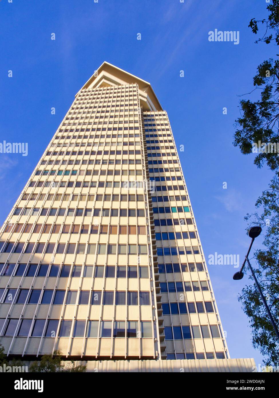 Barcelona, Spain - November 20, 2022: Edificio Colon low angle view. An office skyscraper with ...