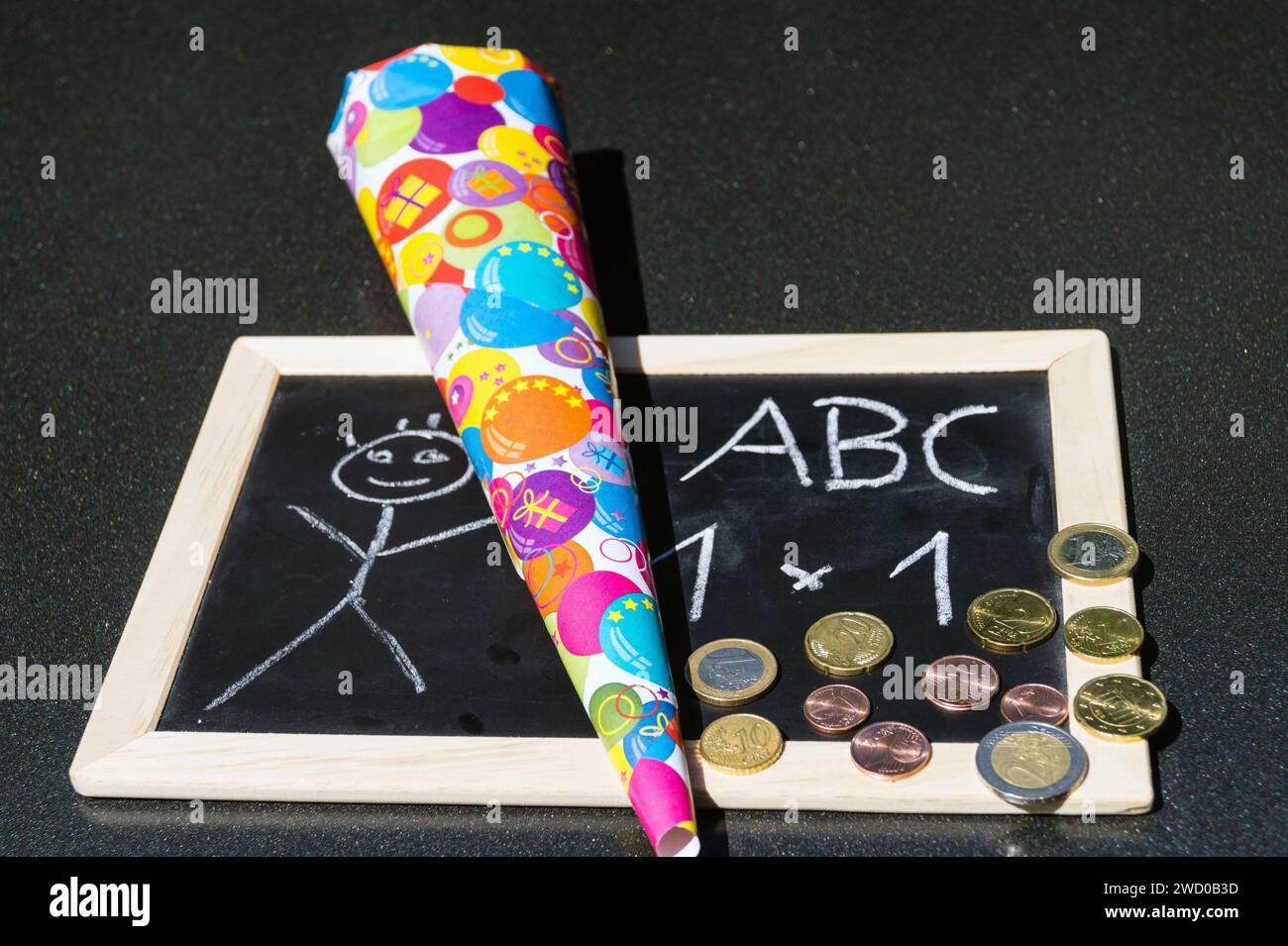 school cone, slate and money, symbolic image for school fees Stock ...