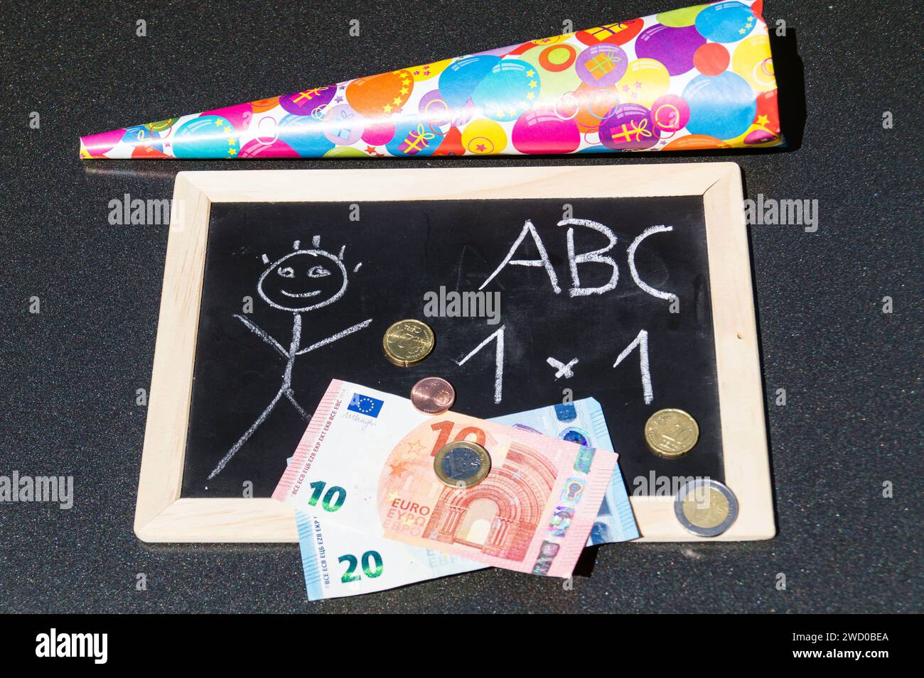 school cone, slate and money, symbolic image for school fees Stock ...
