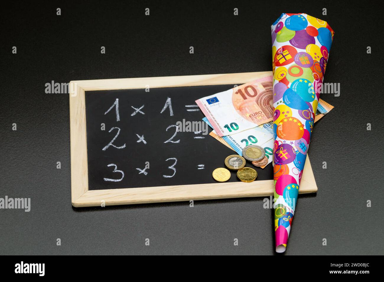 school cone, blackboard and money, symbolic image for school fees Stock ...