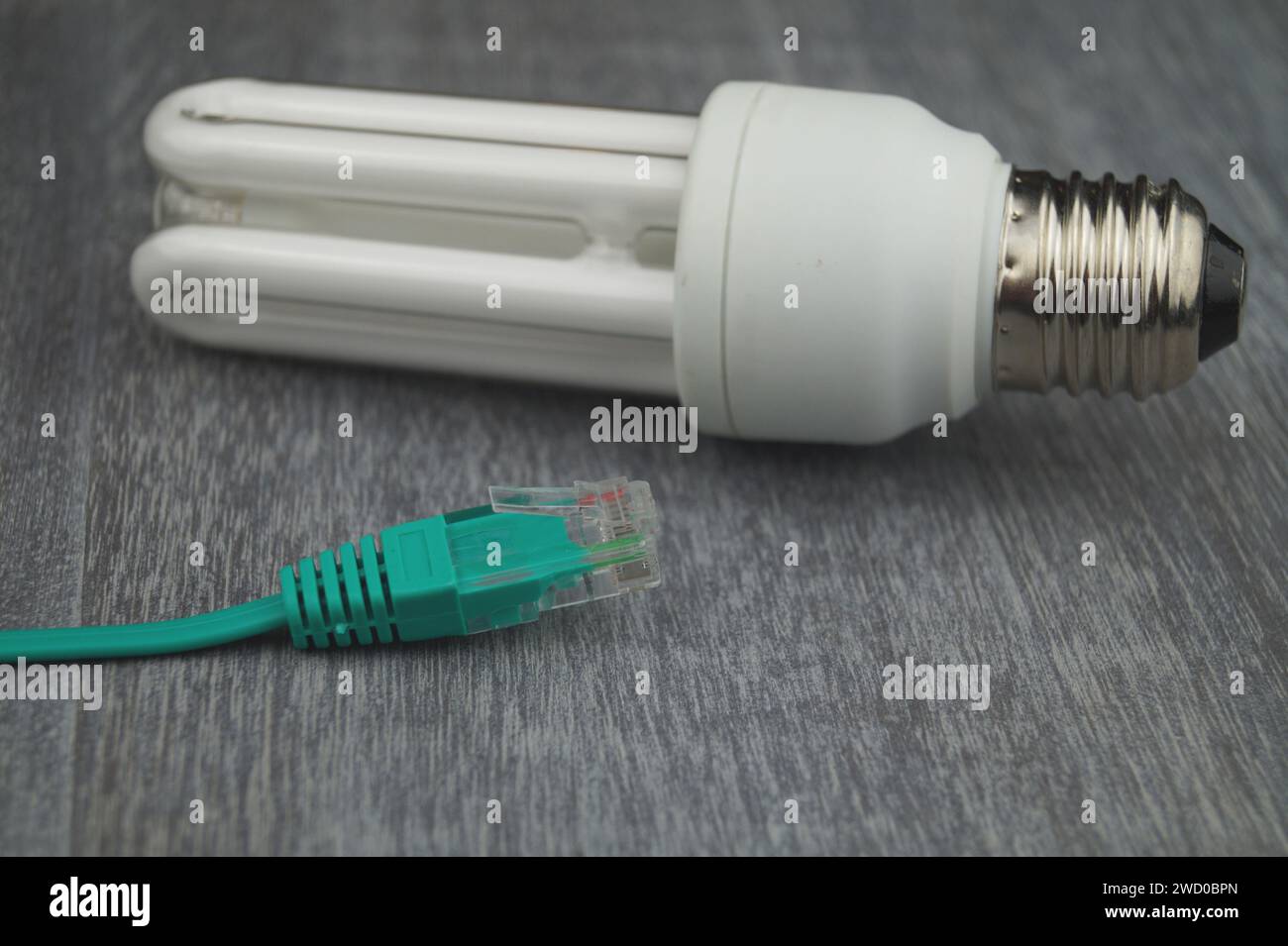 Energy-saving lamp and network plug, symbolic image for smart home ...
