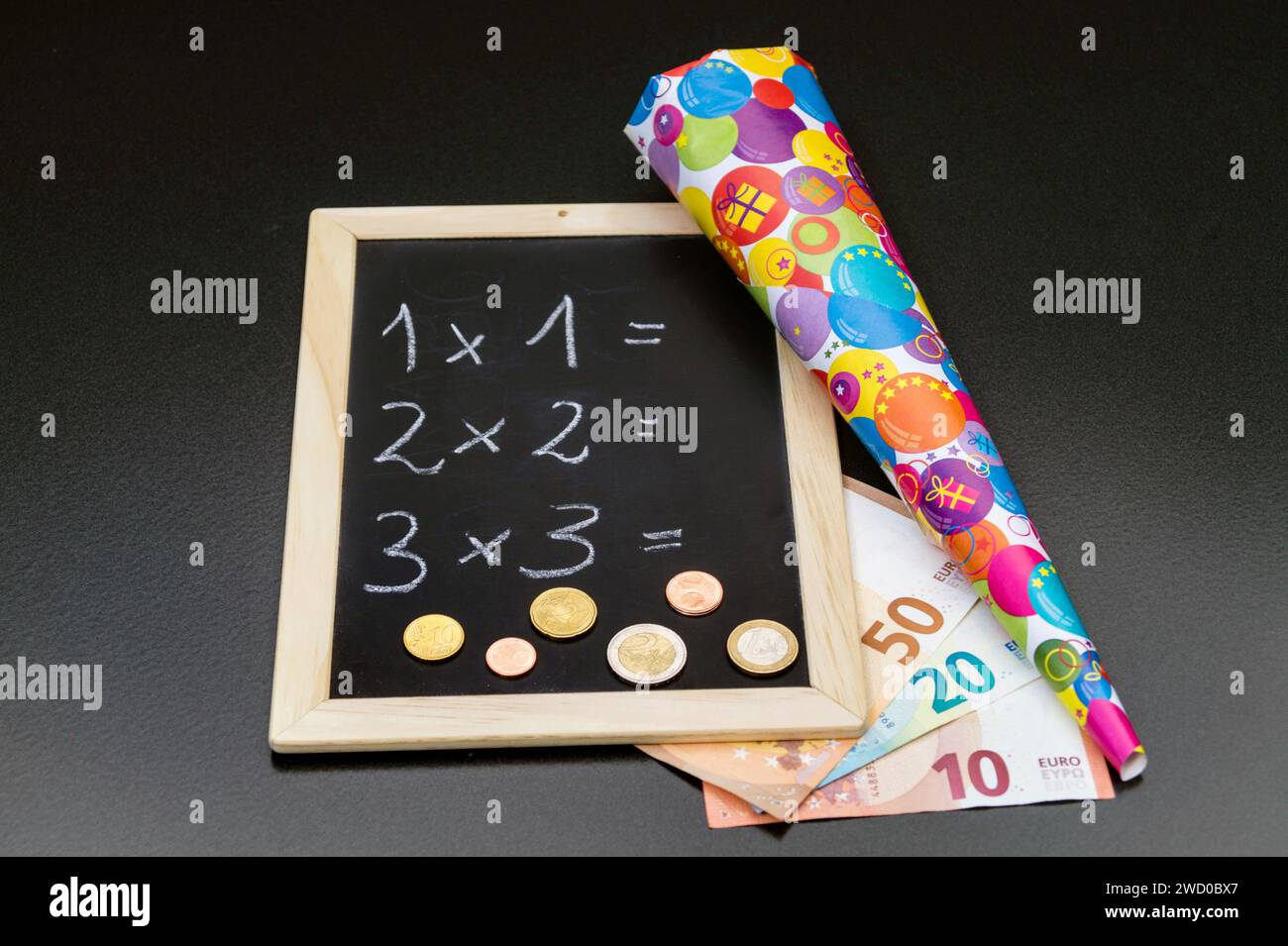 school cone, slate and money, symbolic image for school fees Stock ...