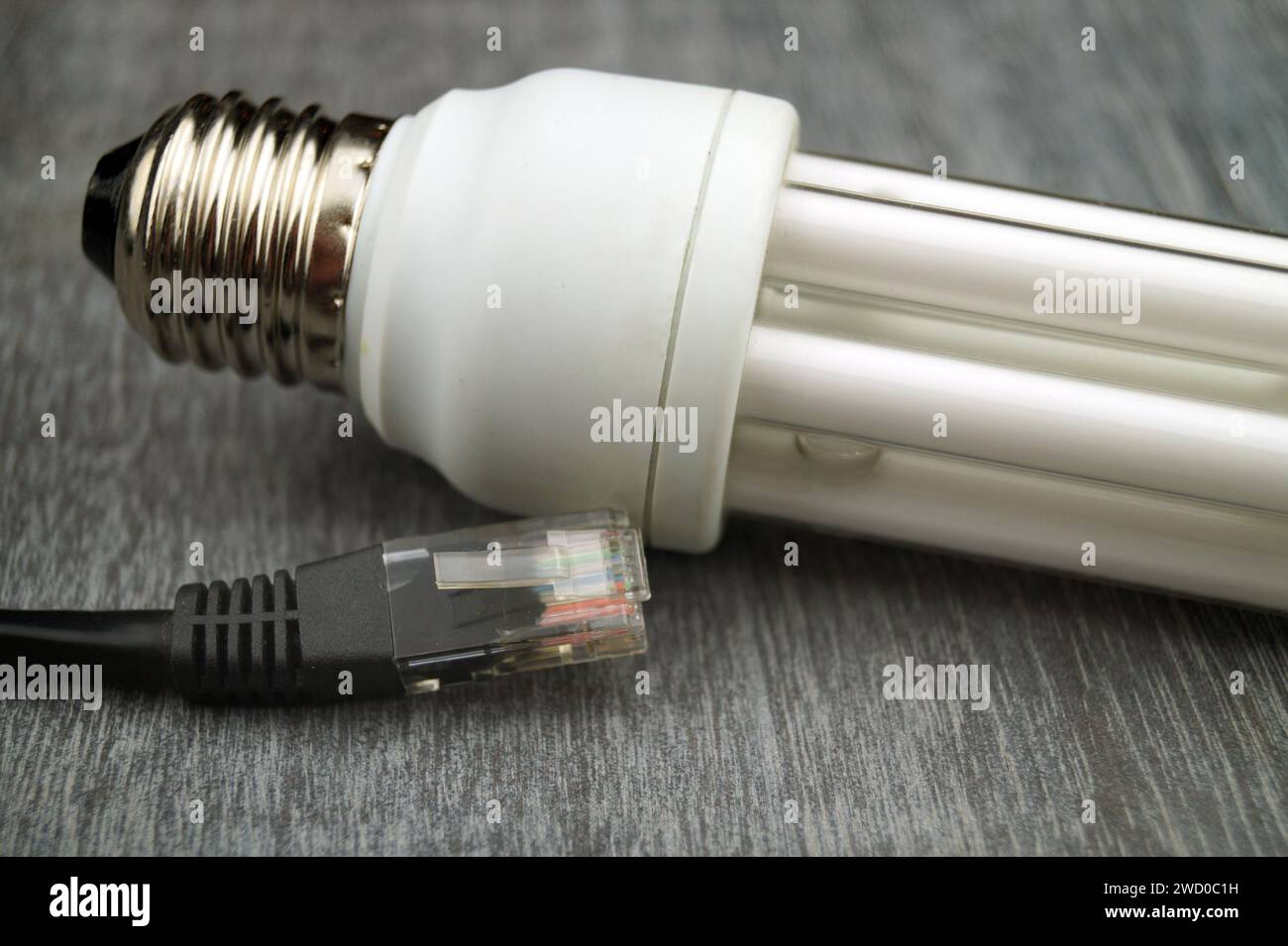 Energy-saving lamp and network plug, symbolic image for smart home ...