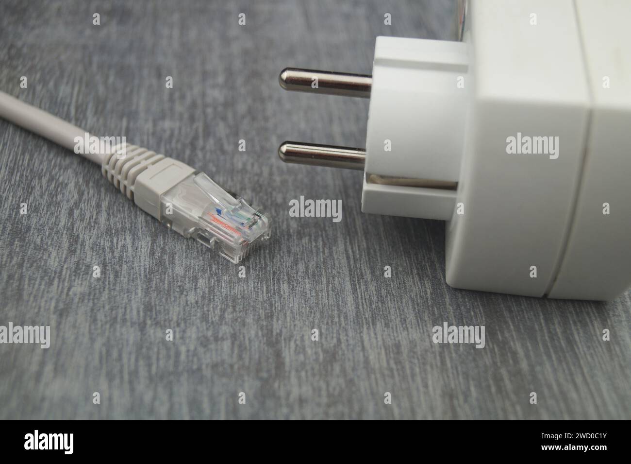 Plug and network plug, symbolic image for smart home Stock Photo - Alamy