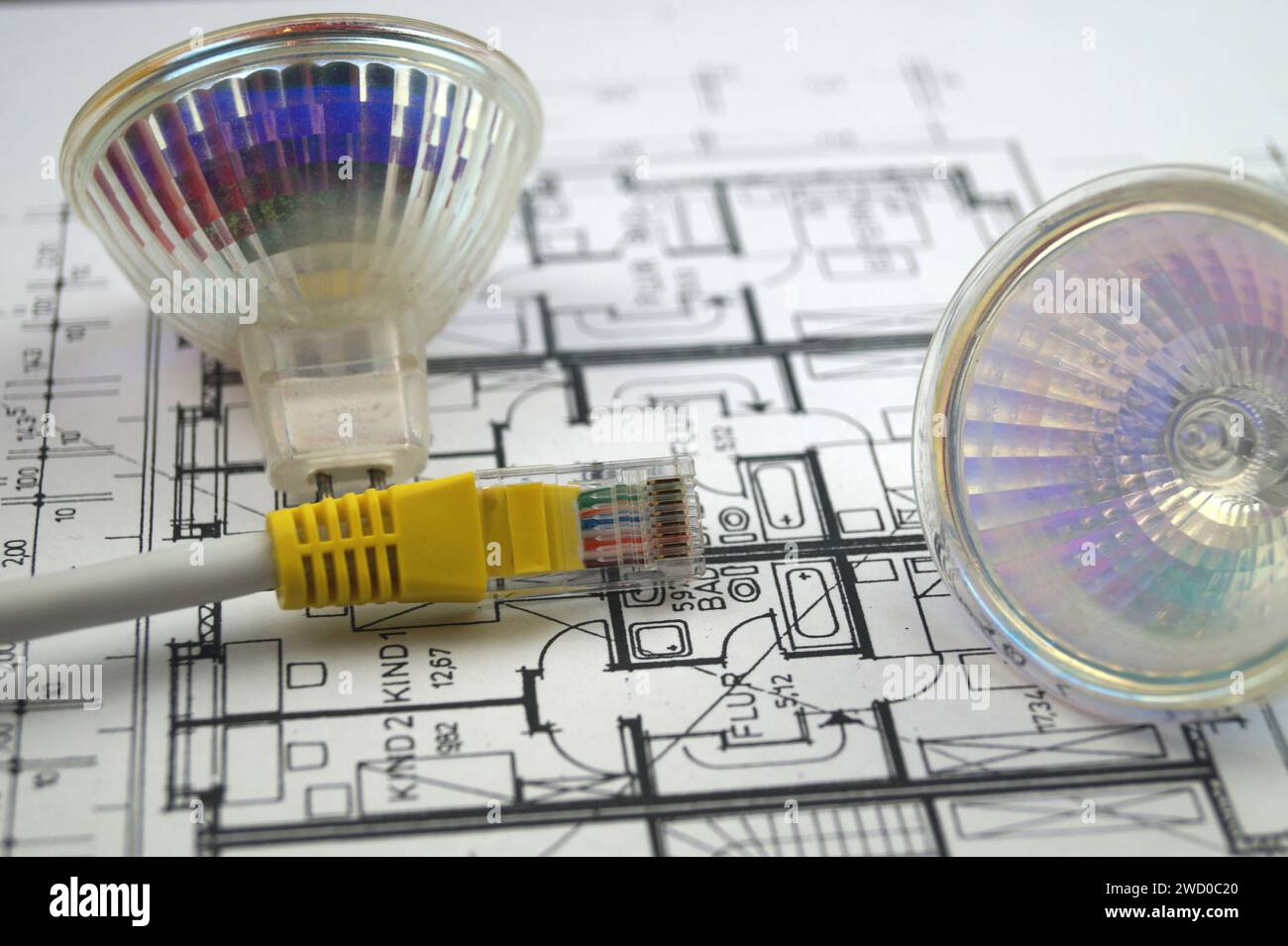 reflector lamps and network cable on construction drawing, symbolic ...