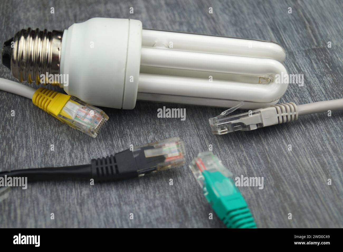 Energy-saving lamp and network plug, symbolic image for smart home ...