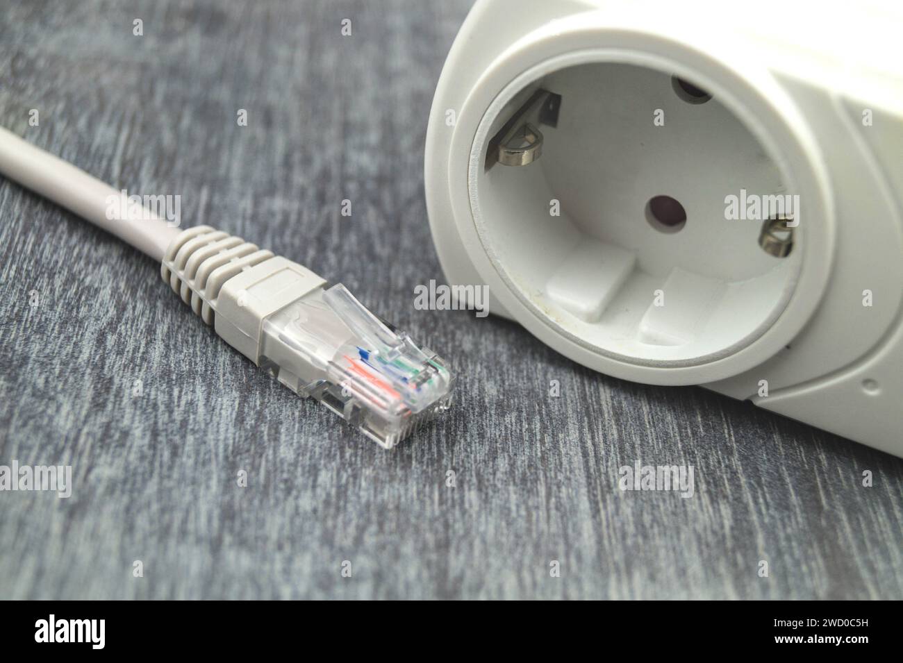 Plug and network plug, symbolic image for smart home Stock Photo - Alamy