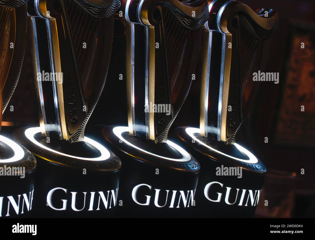 Pumps for draught Guinness in an Irish bar Stock Photo - Alamy