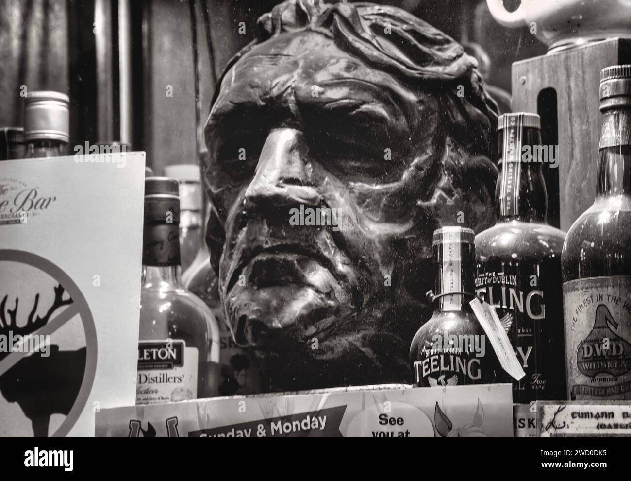 Mysterious bust behind the bar in an Irish pub Stock Photo - Alamy