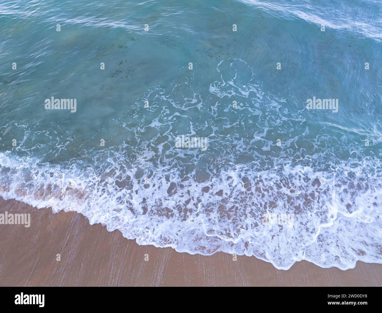 Top view beach with waves crashing on sandy shore,Beautiful waves sea ...