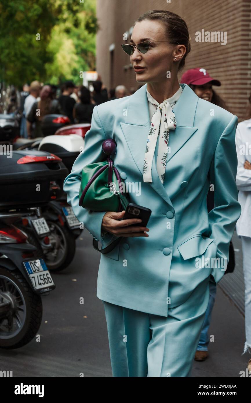 A guest wears mint color suit, outside Fendi show during Milan Fashion ...