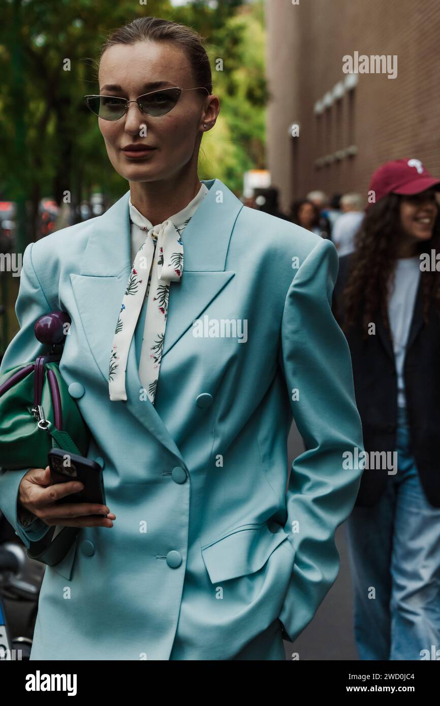 A guest wears mint color suit, outside Fendi show during Milan Fashion ...
