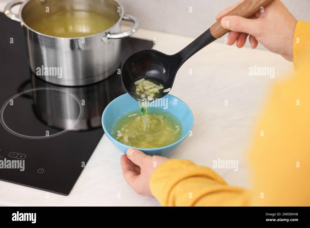 Fresh chicken broth pouring hi-res stock photography and images - Alamy