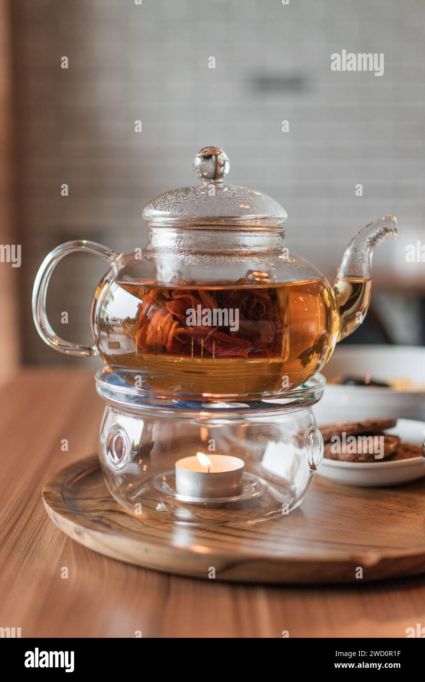 Transparent glass herbal teapot Stock Photo - Alamy