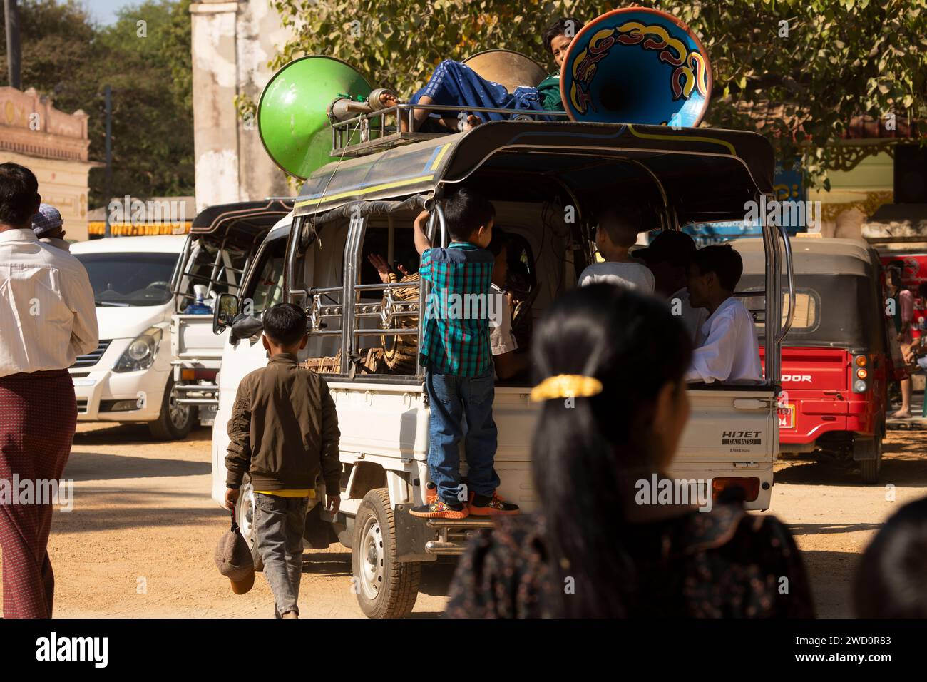 Bagan, Myanmar - 25 Dec, 2019: A group of children travel in a van with ...