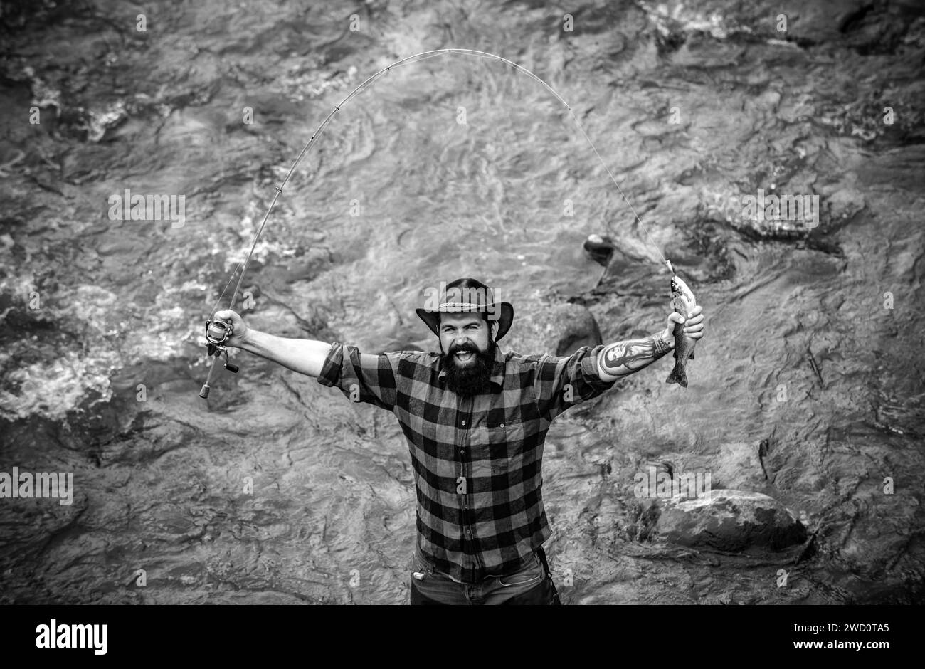 Fisherman fishing on a rever. Excited amazed fisher man in water ...