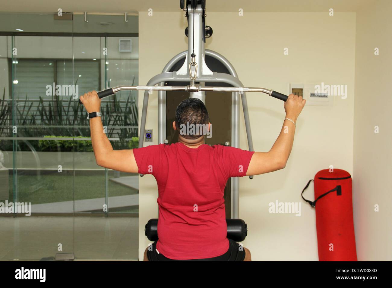 40-year-old dark-skinned Latin man does exercises to strengthen chest ...