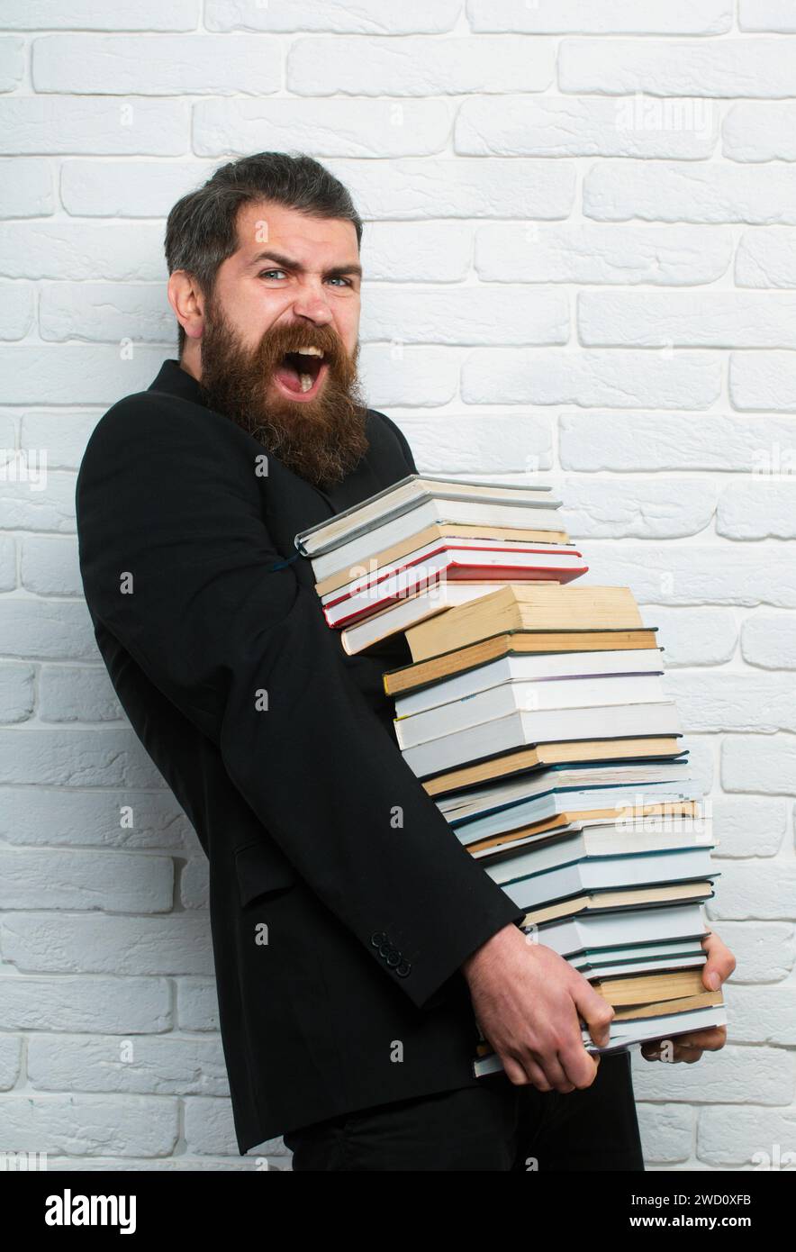 Funny teacher or professor with book stack. Thinking serious mature ...