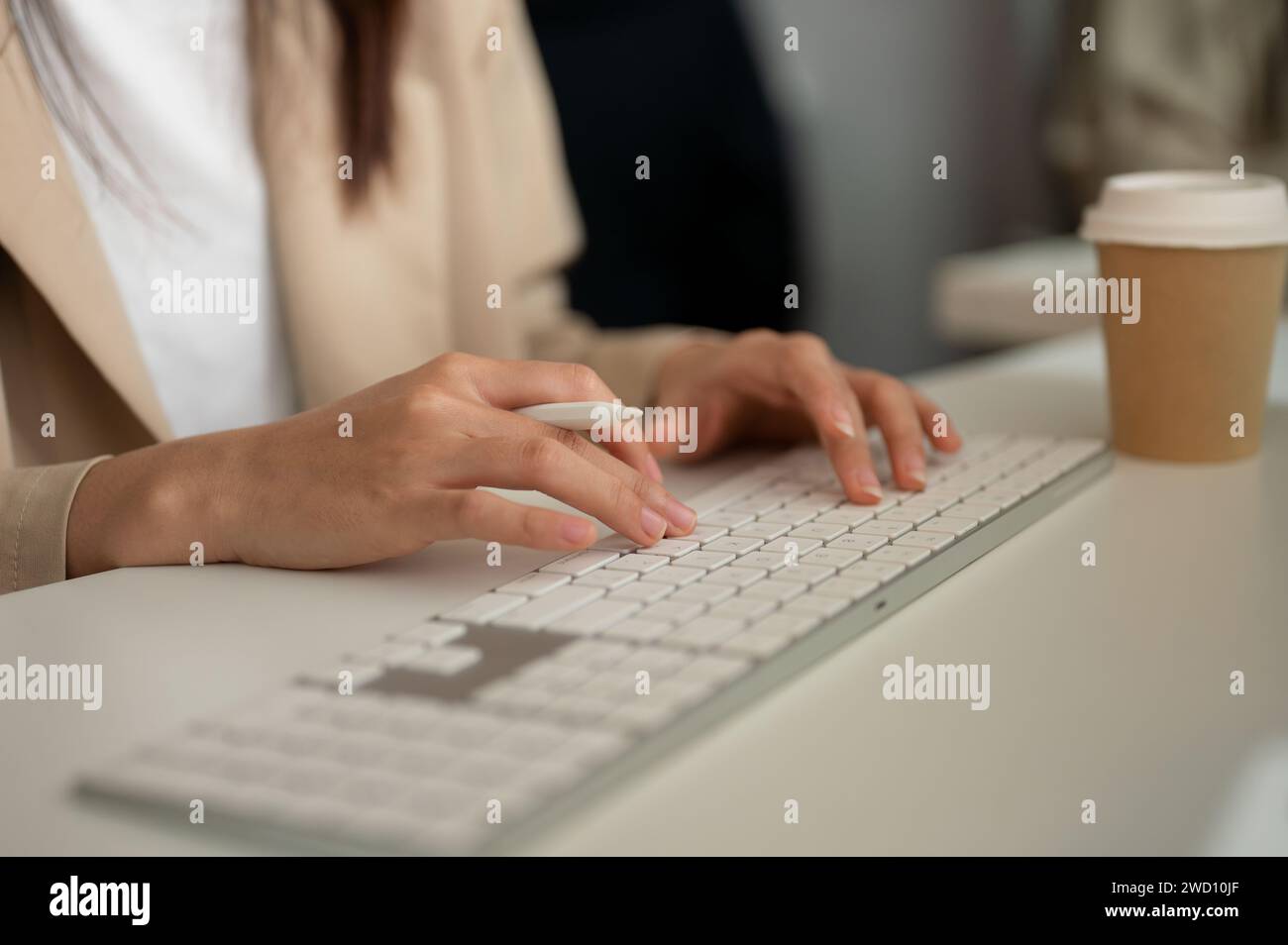 Close-up image of a businesswoman working at her desk in the office ...