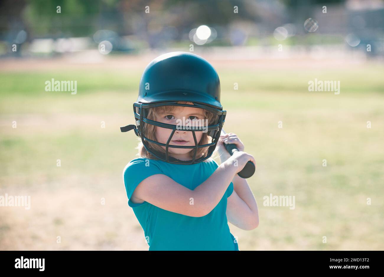 Little child baseball player focused ready to bat. Sporty kid players ...