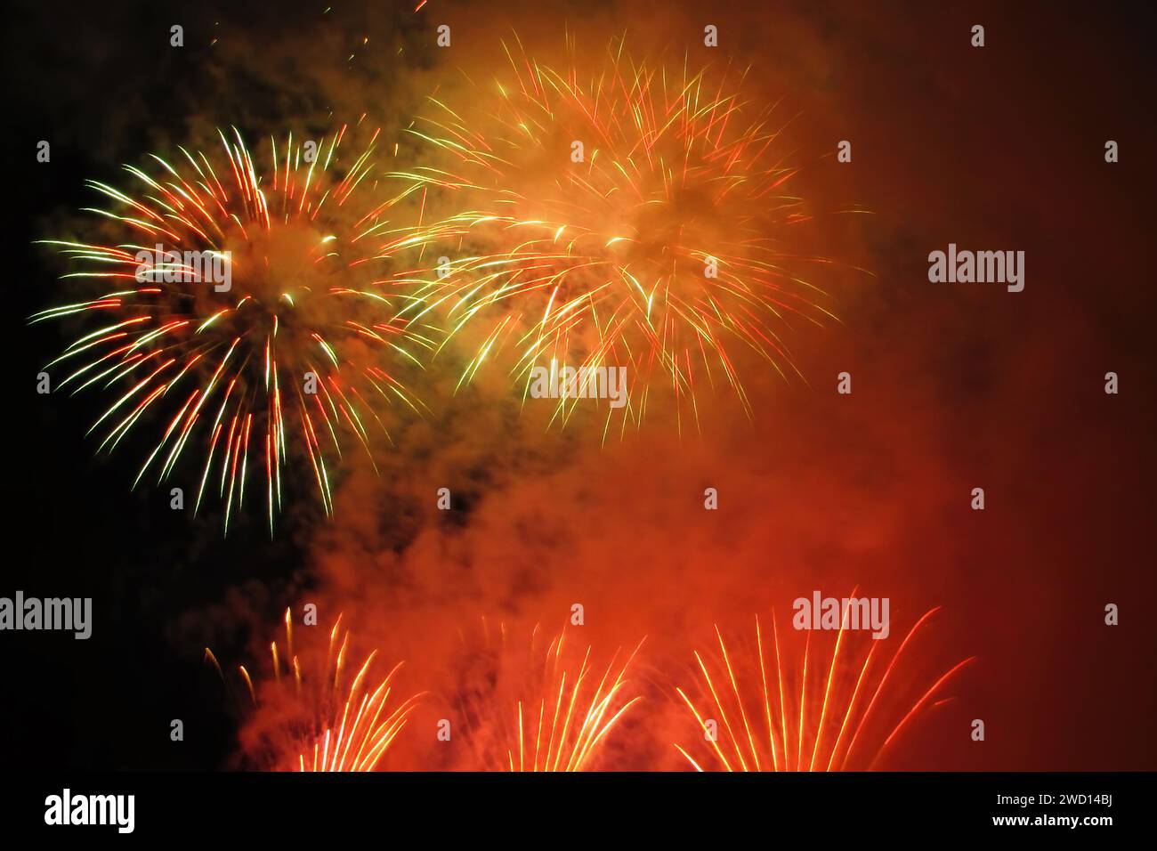 Orange bright fireworks sparks in the black night sky. Festive events ...