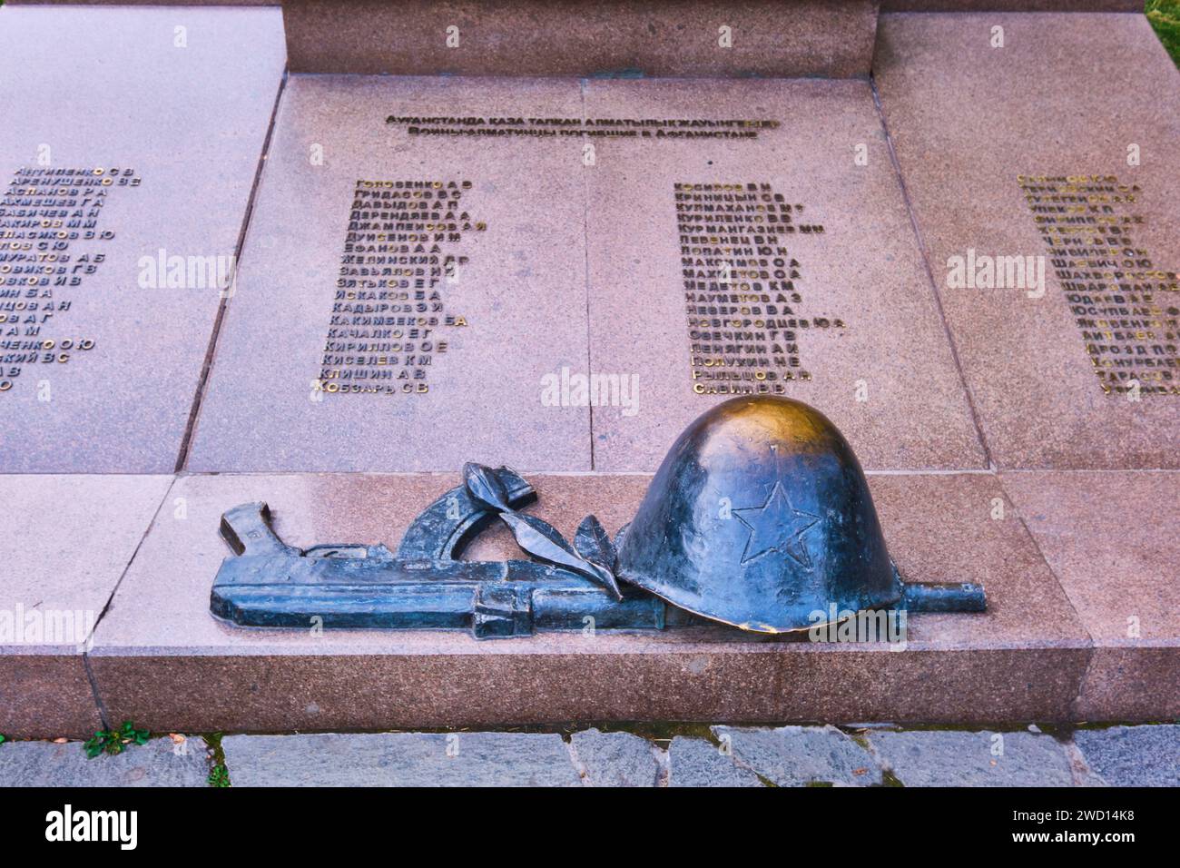 Detail of a helmet and rifle at a military, armed forces war memorial ...