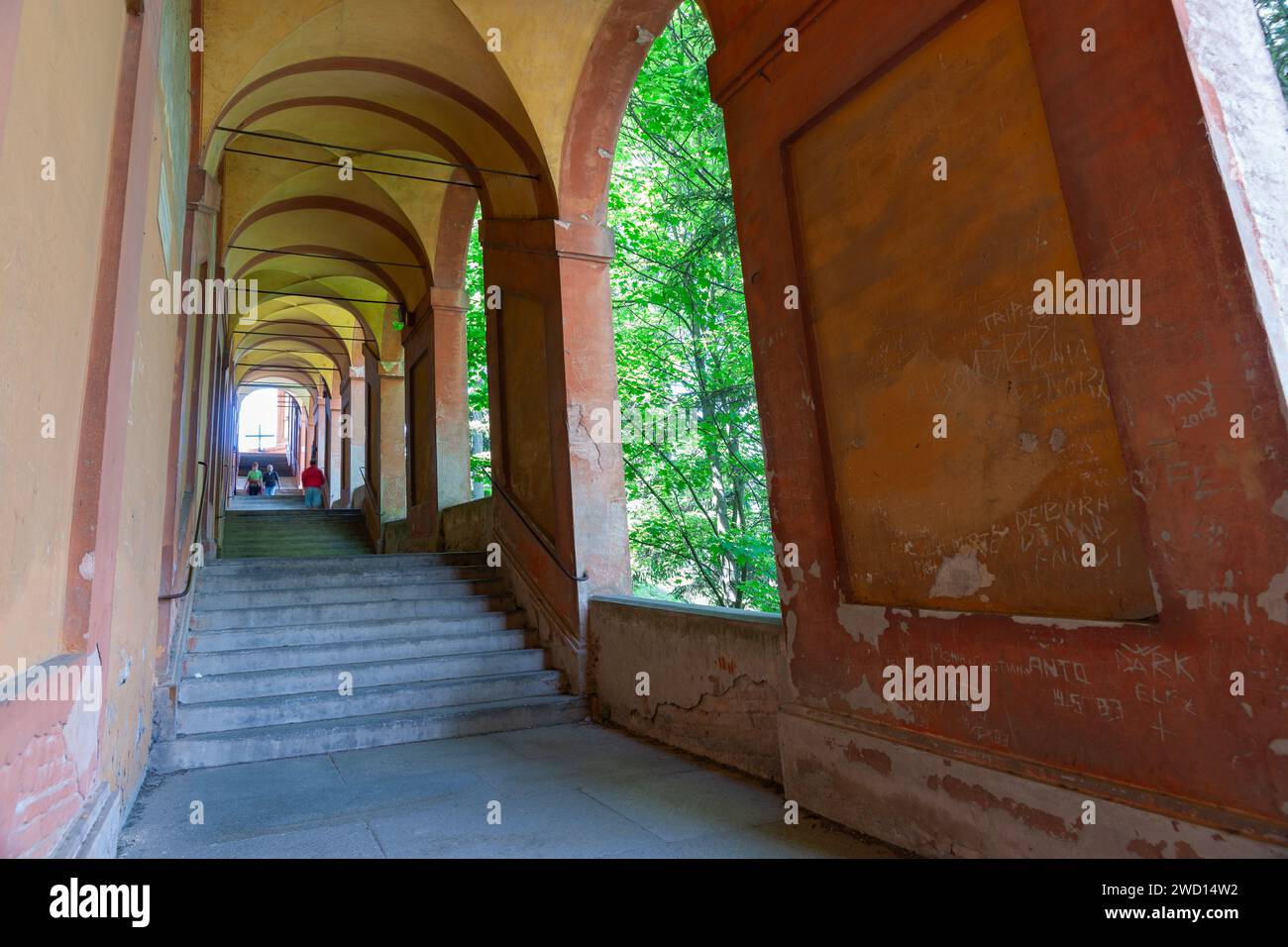 Bologna Italy - May 11 2011; Arched historic portico of San Luca steps ...