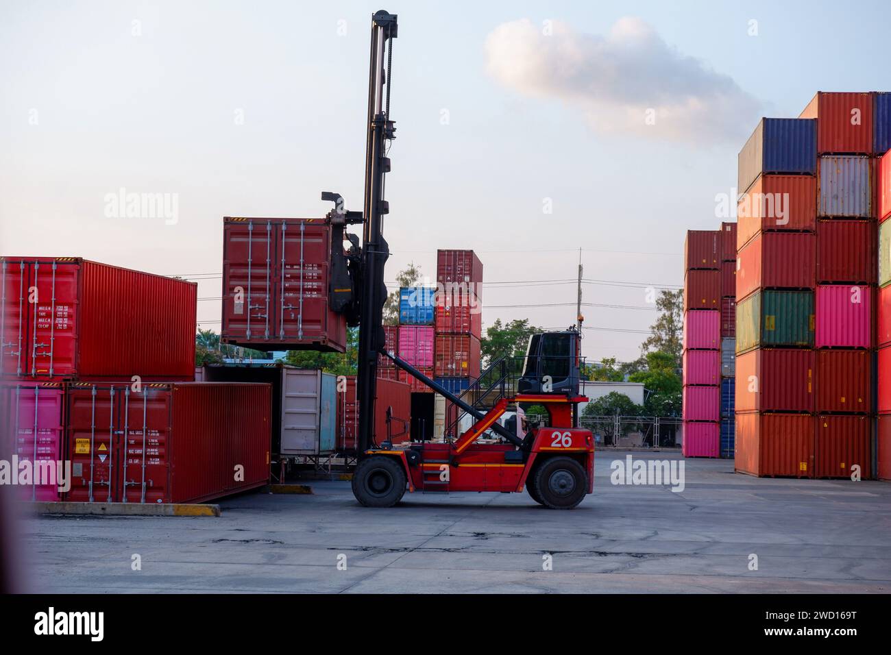 Container truck in a shipping yard with stacks of colorful containers ...