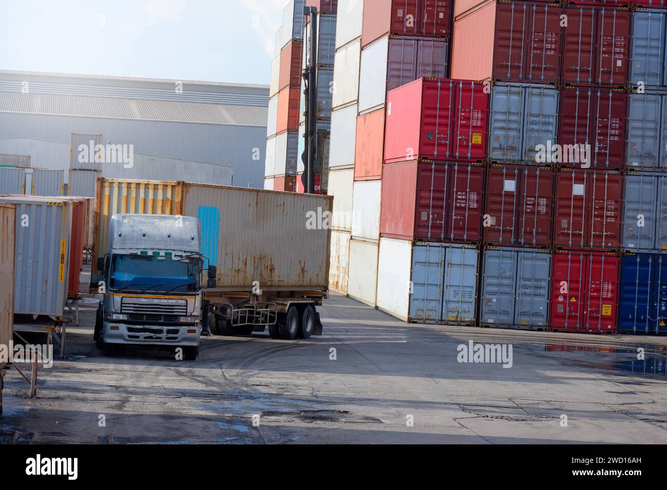 Container trucks and container stacks Stock Photo - Alamy
