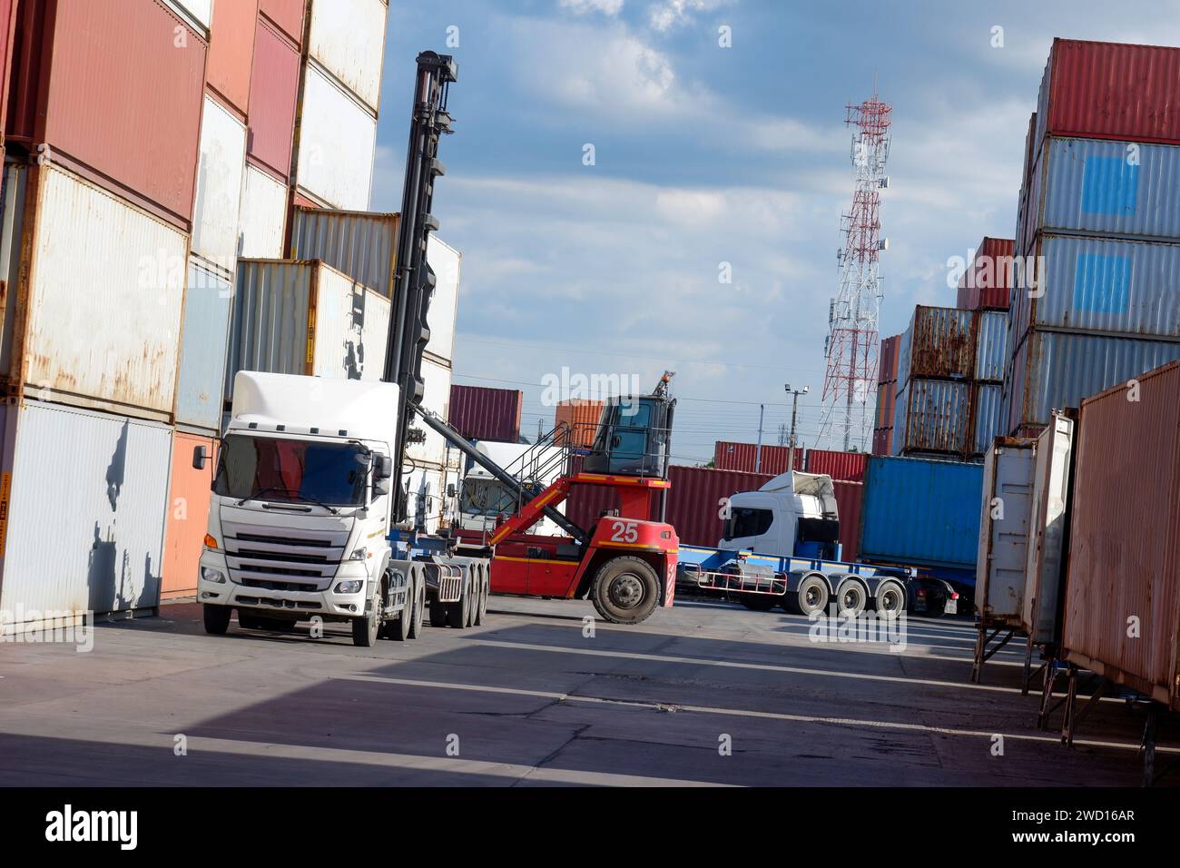 Moving containers at the shipyard Stock Photo - Alamy