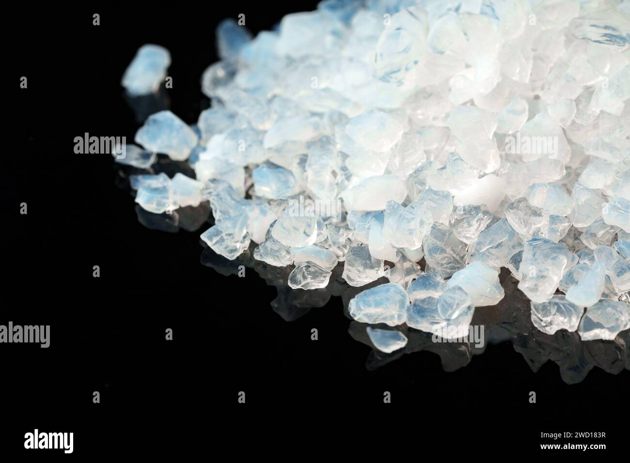 Pure silica gel crystals on black background Stock Photo - Alamy