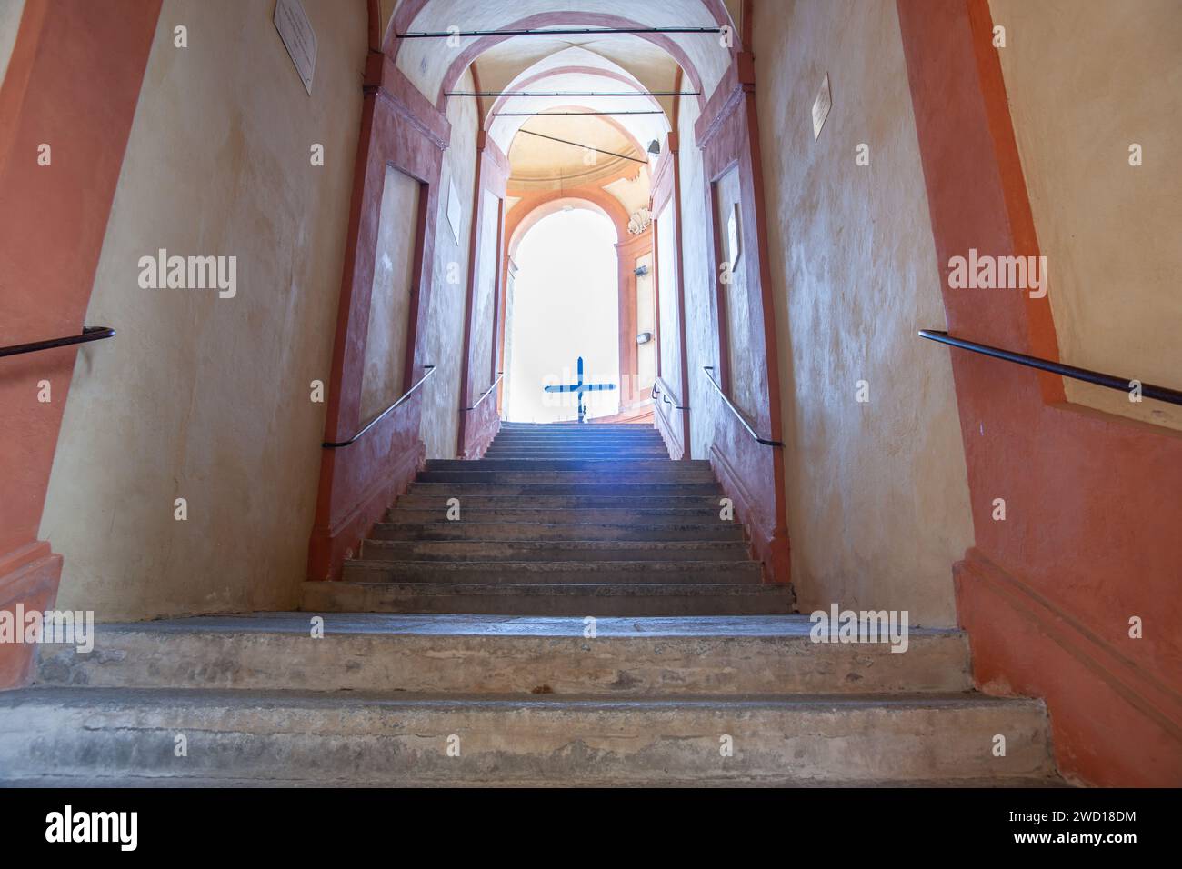 Steps lead up under arched portico of San Luca to cross back lit by ...