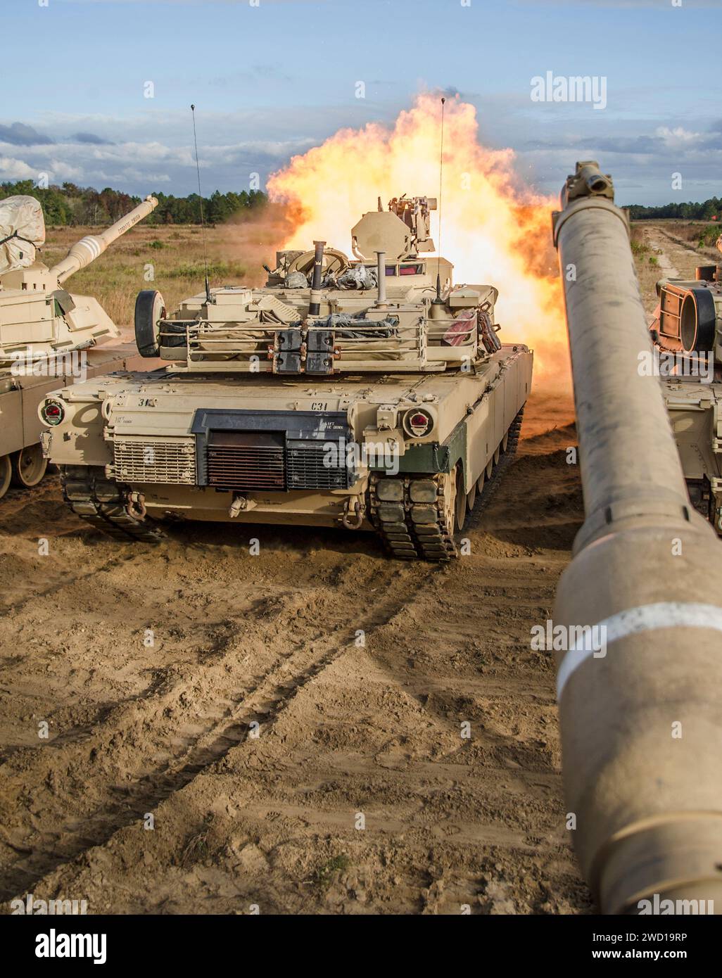 An M1A2 SEP Abrams Tank fires during a live-fire accuracy screening ...