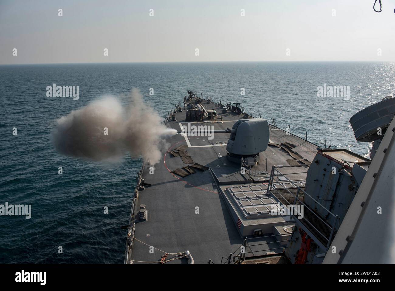 Guided-missile destroyer USS Mahan (DDG 72) fires its Mark 45 5-inch ...