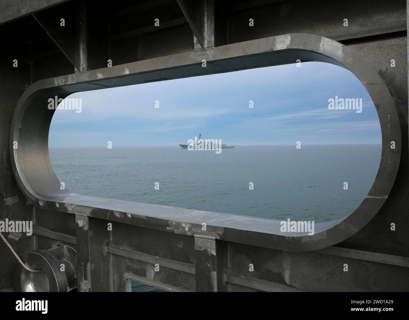 USS Forest Sherman as it passes expeditionary fast transport ship USNS ...