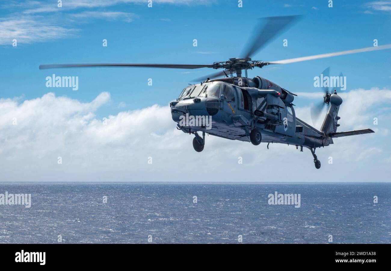An MH-60S Sea Hawk helicopter flying over the Pacific Ocean Stock Photo ...