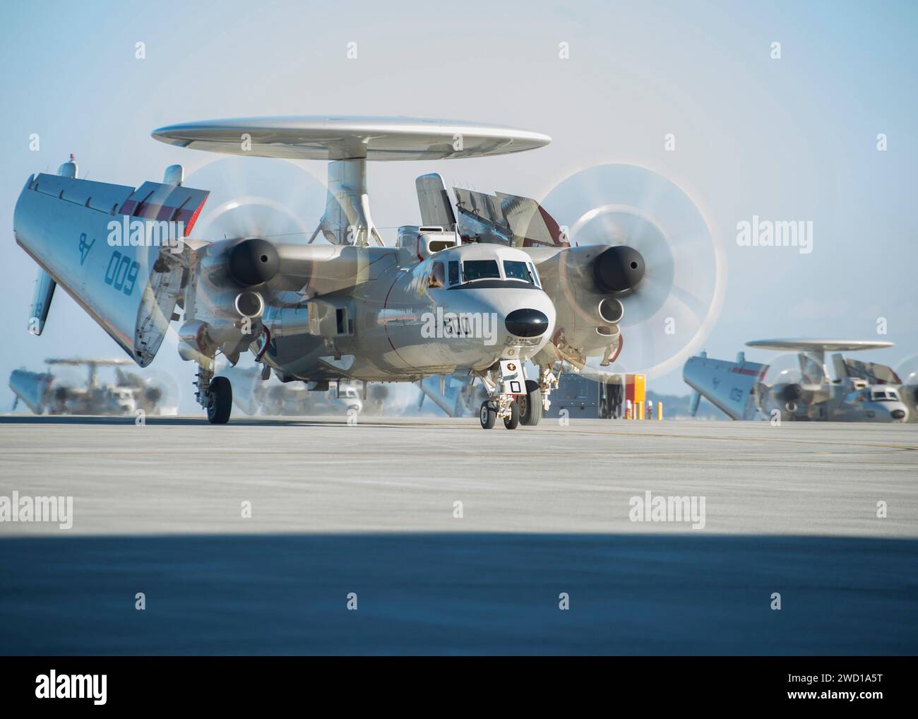 Five E2-D Advanced Hawkeye aircraft taxi the runway after landing Stock ...