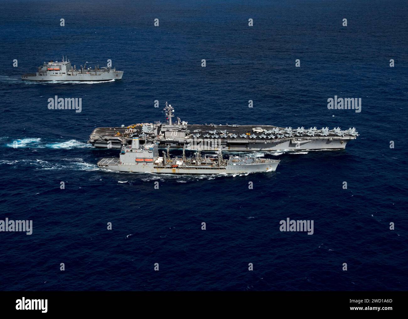 USS Carl Vinson in a dual replenishment-at-sea with USNS Charles Drew ...