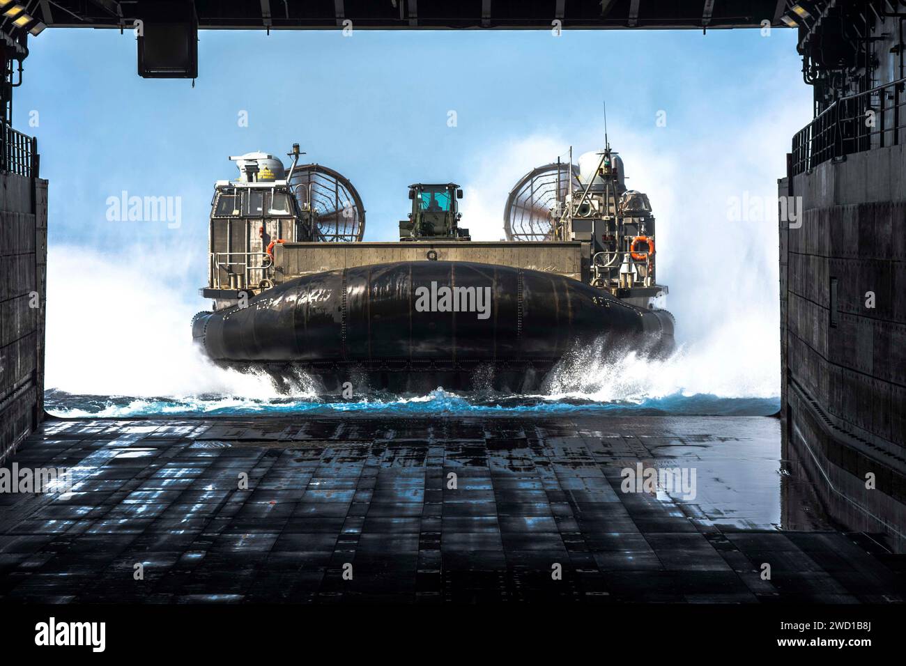 A landing craft air cushion approaches the well deck of USS Green Bay ...