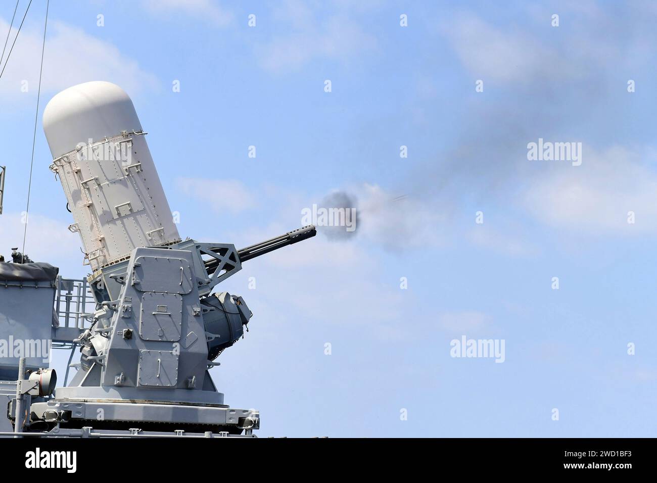 A Mark 15 Phalanx close-in weapons system fires rounds aboard guided ...
